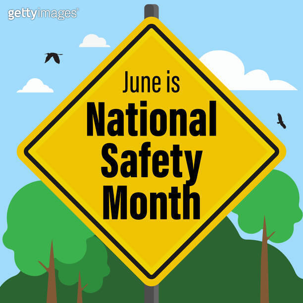 June is National Safety Month. Large yellow warning sign against blue ...