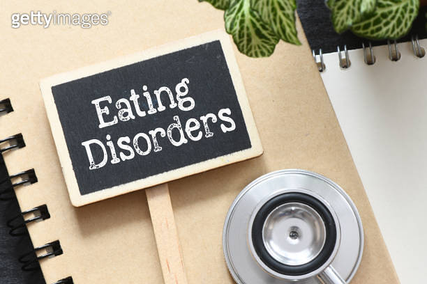 Eating Disorders words on a small chalkboard next to a stethoscope. 이미지 ...