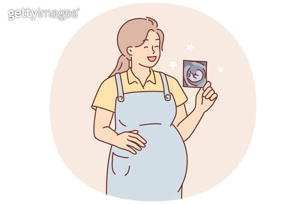 Pregnant woman holds ultrasound picture and laughs rejoicing at ...