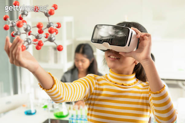 children girl using vr learning molecular structure in science ...