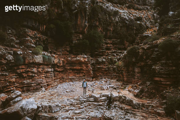 Man exploring Jacobs canyon in Rhodes, Greece traveler hiking solo ...