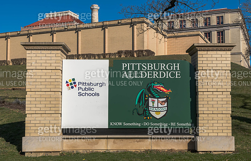 The sign for Taylor Allderdice High School in front of the building in ...