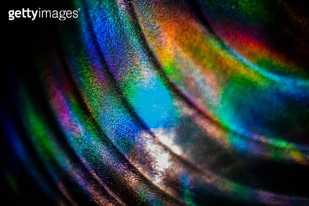 Footage of refraction of light through plastic containers in the shape ...