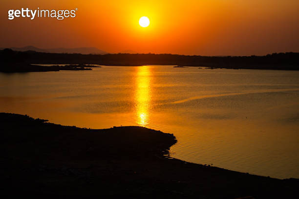 Scenic sunset view from Sathanur Dam which forms the Sathanur reservoir ...