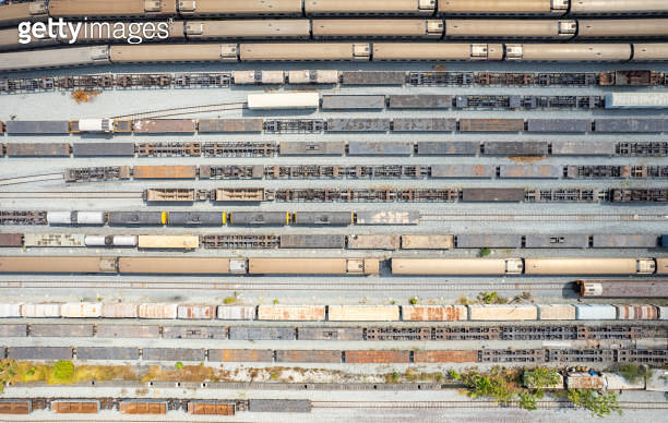 Aerial top view Passenger and freight trains on the railway yard for ...