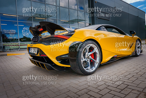 Yellow McLaren 765LT parked at the Restyling Workshop, on a cloudy day ...