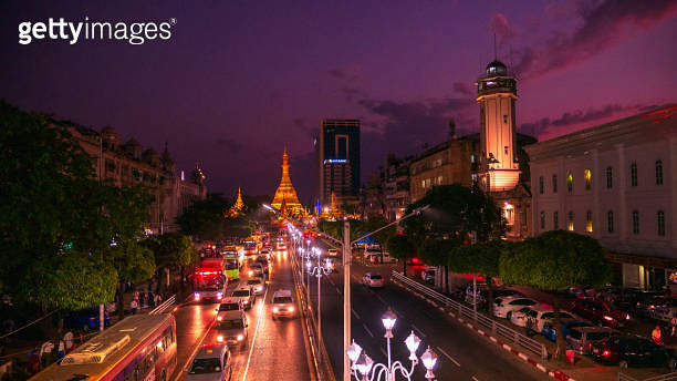 Streets of downtown Yangon Myanmar road to Sule Gold Pagoda sunset with ...