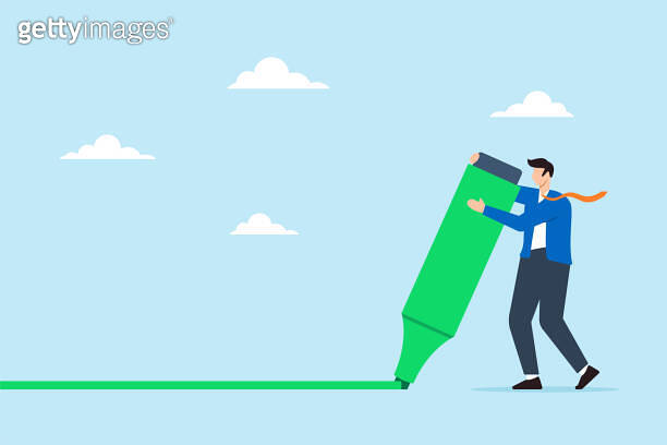 Serious businessman highlights important markers with highlighter pen ...