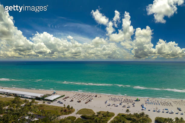 Tourism infrastructure in southern USA. South Beach sandy surface with ...