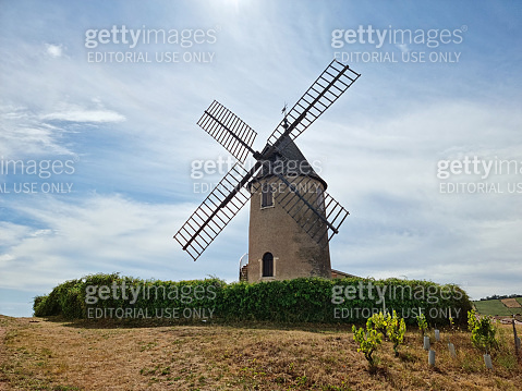 The eponymous windmill of famous french red wine situated near ...