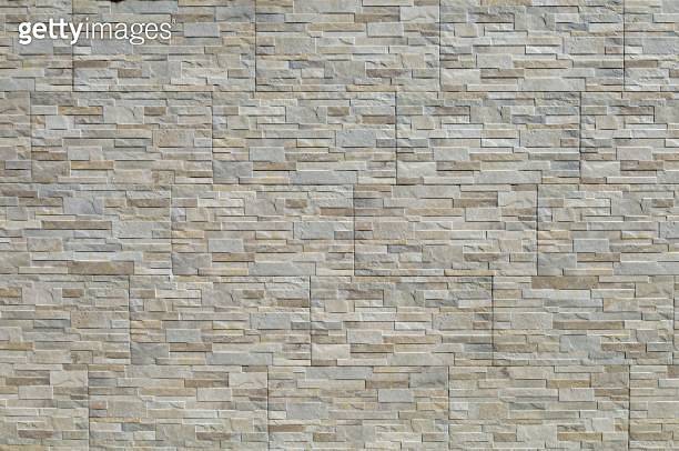 Stoneware paneling wall with stone effect. Colors are shades of brown ...