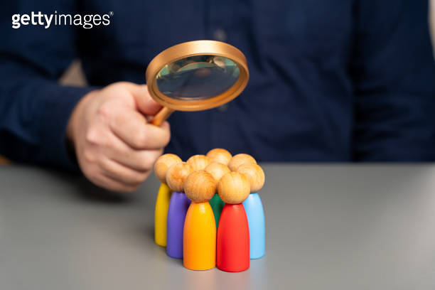 Businessman examines a team member. The concept of finding people and ...