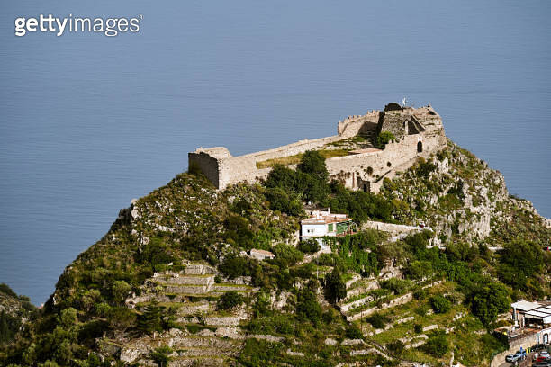 ruins of the medieval castle Castello saraceno in the city of Taormina ...