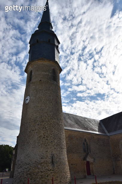 The pointed bell tower of the church in Conge sur Orne, in Sarthe, in ...