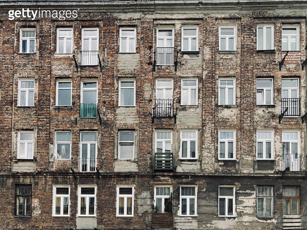 European disadvantaged area of the city with old, unkempt buildings ...