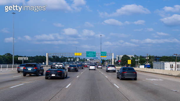 Highway traffic in East Houston. Busy multi-lane road with cars and ...