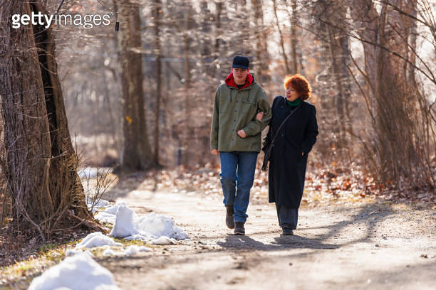 Family bonding of mother and her autistic son. Red haired woman and ...