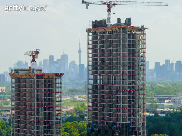 A construction site for high-rise buildings, with the downtown Toronto ...