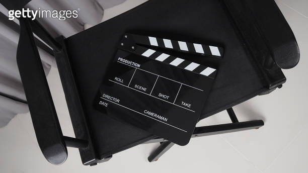 Clapper board or movie slate with black director chair use in video ...