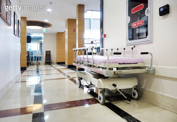 Empty Hospital Hall. ER, emergency and lobby at clinic with stretcher ...