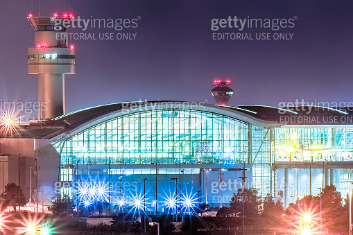 Lester B. Pearson International Airport with control tower at night ...