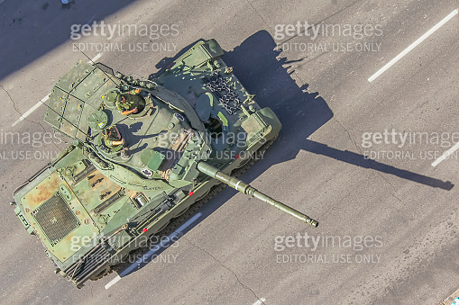 A Canadian army tank participating at the Calgary Stampede parade ...