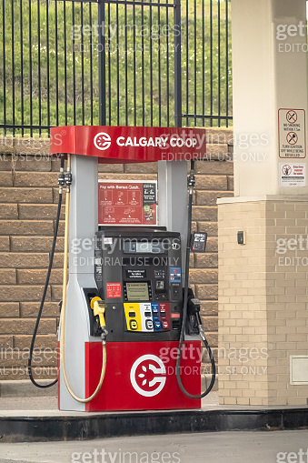 A red and white gas pump at a Calgary Co-op gas station with safety ...