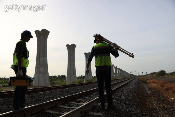 Pile Construction, Civil engineer and technician carry survey camera ...