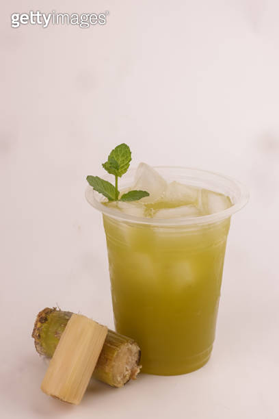 Es Tebu or Fresh Squeezed Sugar Cane Juice with Fresh Sugar Cane on ...