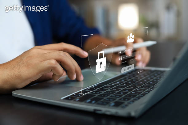 Cybersecurity and privacy concepts, User interacting with a secure login interface adorned with ...