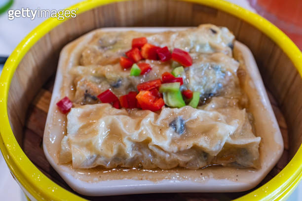 Steam Rolls with chilli sauce served in dish isolated of table top view ...