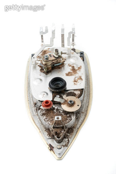 Parts of the mass production electrical iron isolated on white ...