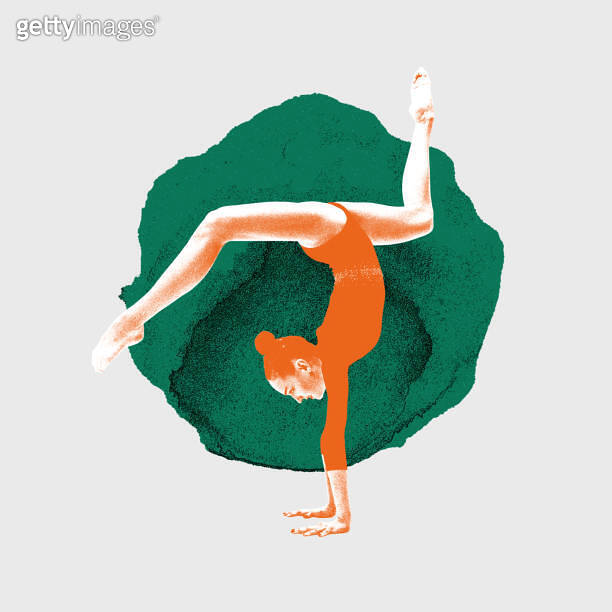 Female gymnast performing handstand against white background with green ...