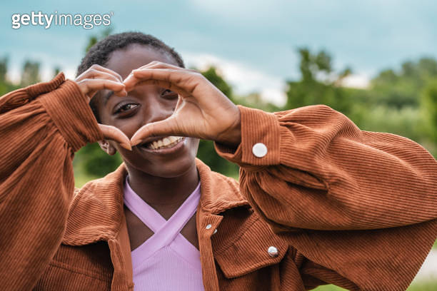 Joyful African Girl Forming Heart Shape with Hands 이미지 (2094518935 ...