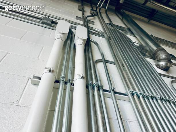 Installation of Electrical metallic conduits on the wall 이미지 ...