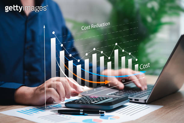 Cost management, Cost reduction concept, Businessman use laptop to ...
