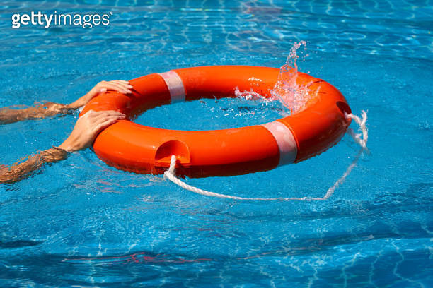 Lifeguard girl training with a life preserver swimming in the pool 이미지 ...