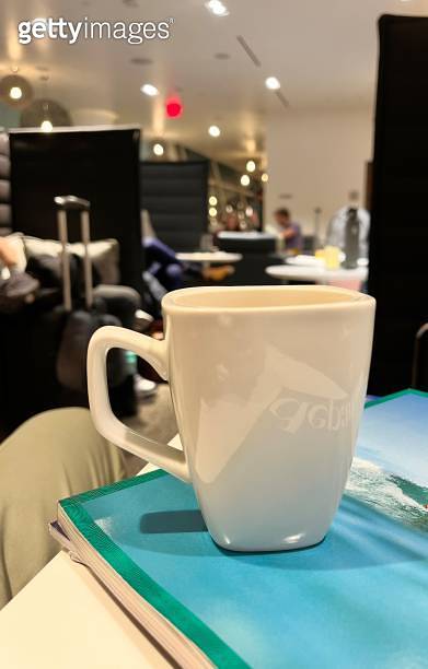 A single coffee cup mug in a VIP lounge at the airport 이미지 (1968235640 ...