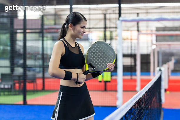 Portrait of young padel player looking at angry competitor 이미지 ...