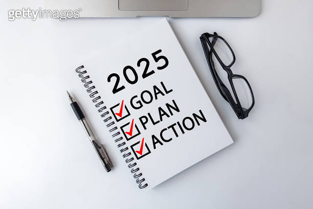 2025 Goal, Plan, Action checklist text on note pad with laptop, glasses ...