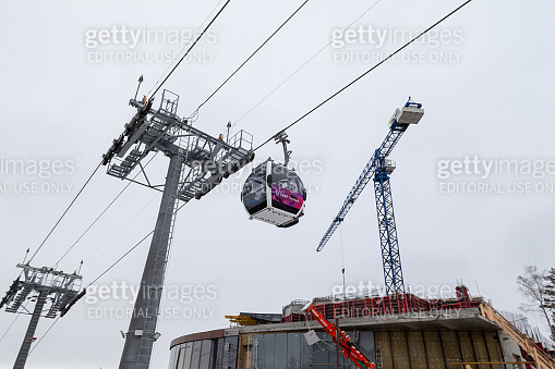 Cabin of a gondola cableway suspended on a rope in the Altai mountains ...
