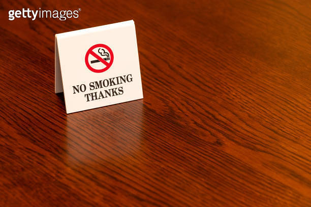 A sign indicating that this is a non-smoking table is placed on a ...