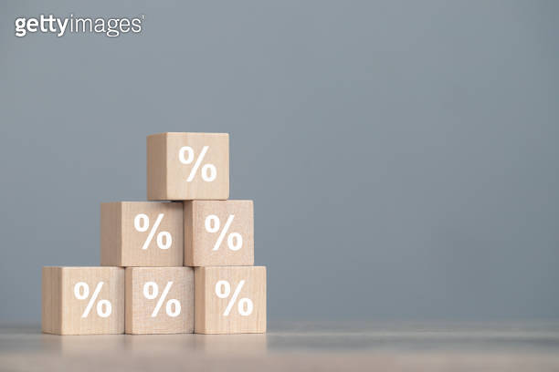 wood cube block with return on investment in stocks, crypto coins ...