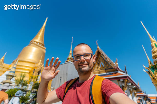 Young Man Having A Video Call At Wat Phra Kaew Complex (The Temple Of ...