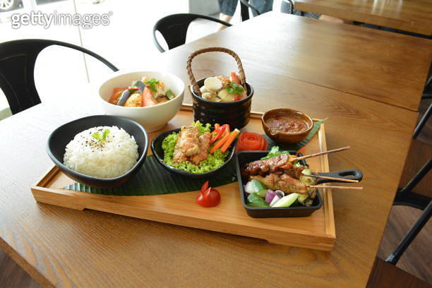 asian bento party set with seafood soup, deep fried snack, chicken ...