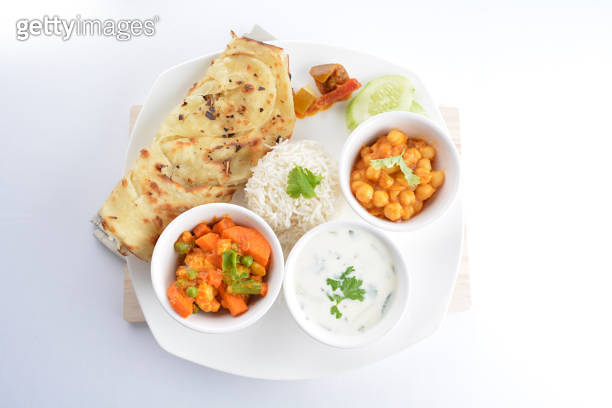 indian baked roti prata canai 2 pieces with spicy chilli curry chicken ...