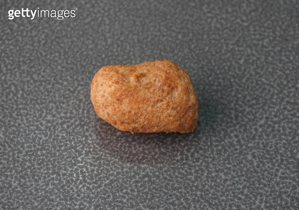 deep fried mini hot dog sausage luncheon meat with spicy sauce on dark ...