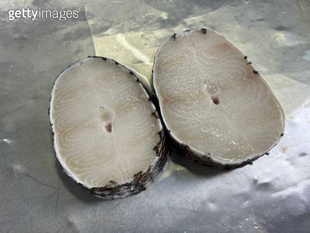 fresh raw cold seafood cod fillet cut grey whole fish ikan on white ice ...