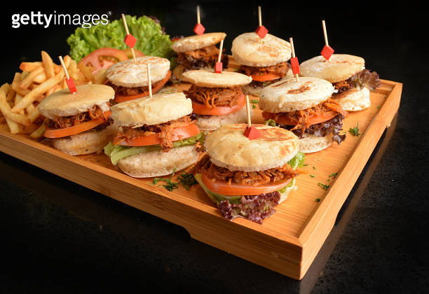 assorted mini burger canapés with meat and vegetable toast in party ...