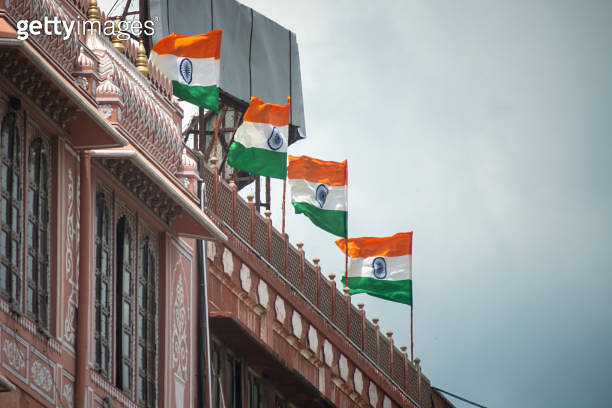 Line of Indian tricolor flag mounted on top of building showing ...